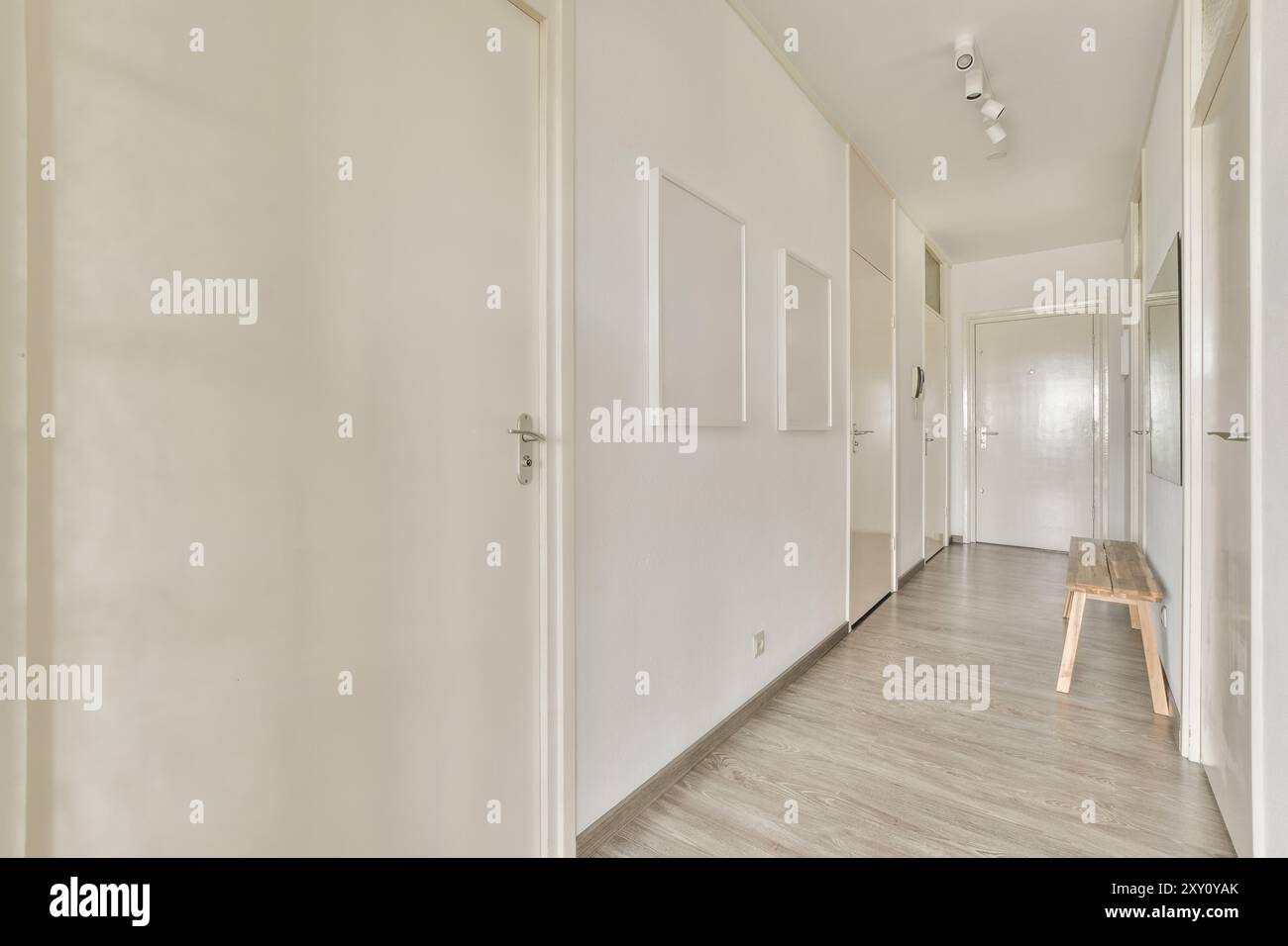 Bright and spacious empty hallway in a modern home featuring white ...