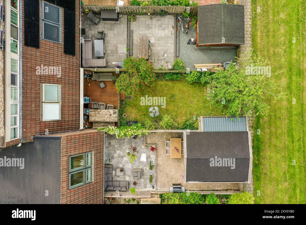 An aerial view captures a neatly organized suburban backyard with a ...