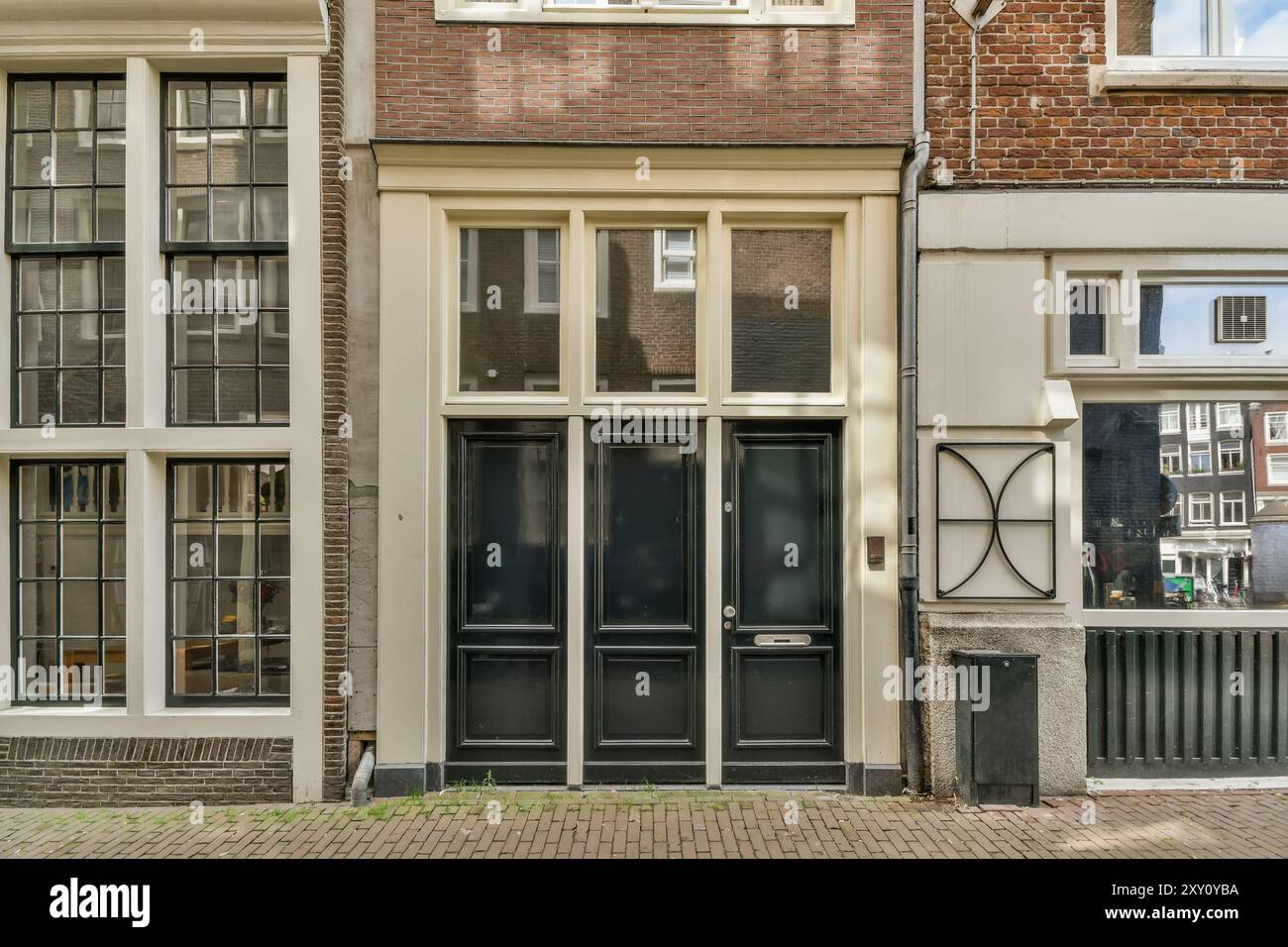 Traditional Dutch building facades with large windows and ...