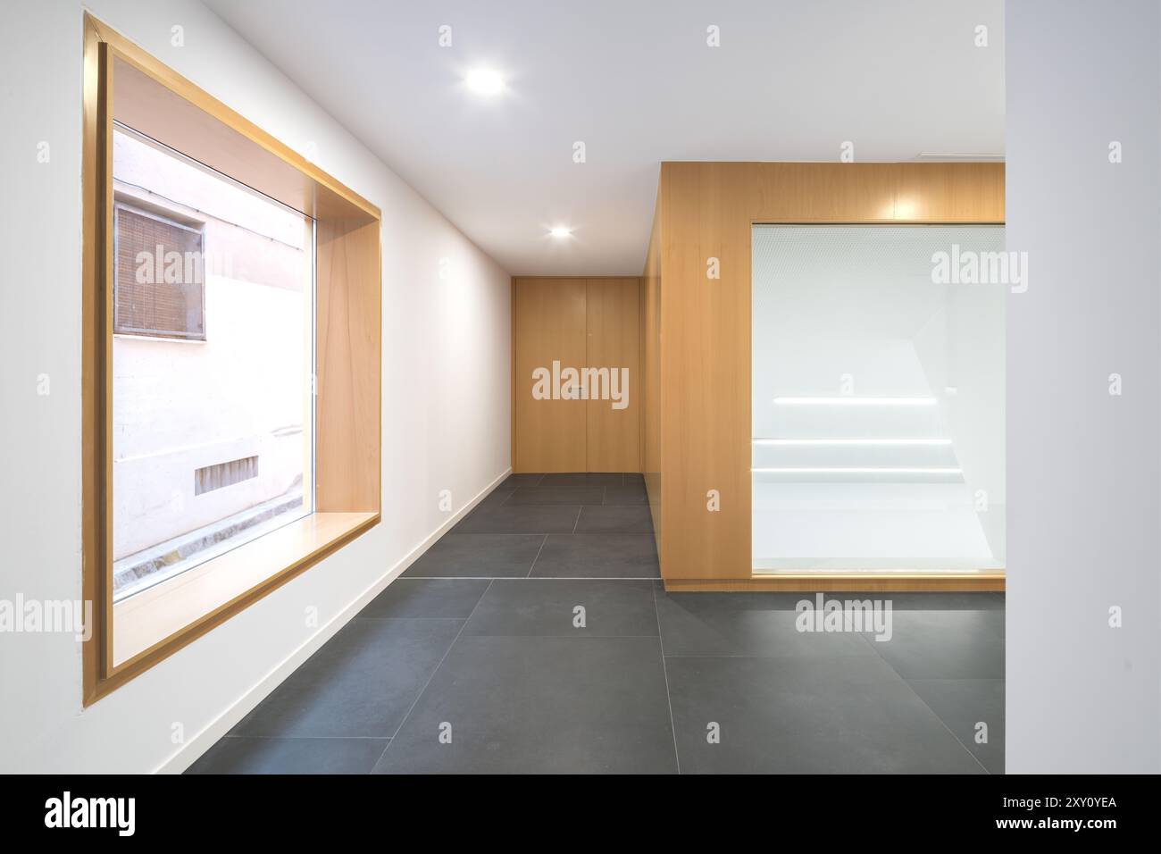 Sleek corridor inside a modern auditorium featuring minimalist interior ...