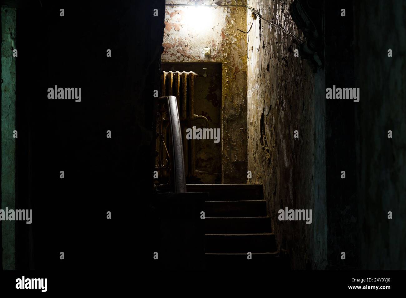 Exit from the basement to the stairs in an old gloomy building ...