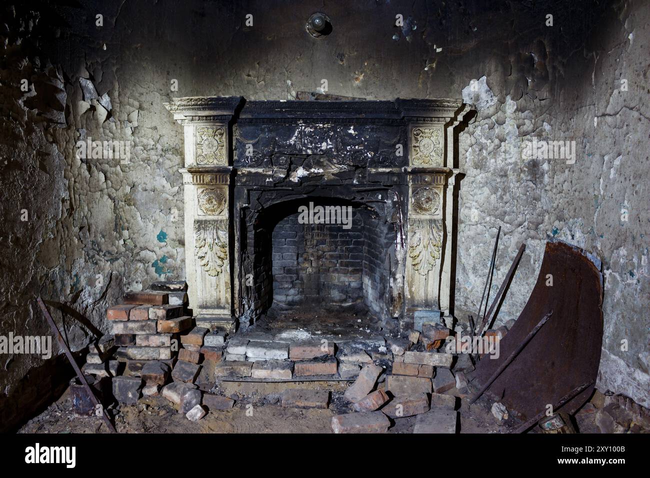 An antique heavily smoked fireplace on the ground floor of a manor ...