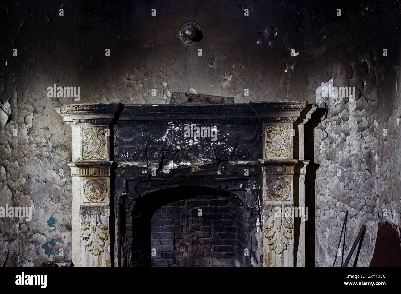 An antique heavily smoked fireplace on the ground floor of a manor ...