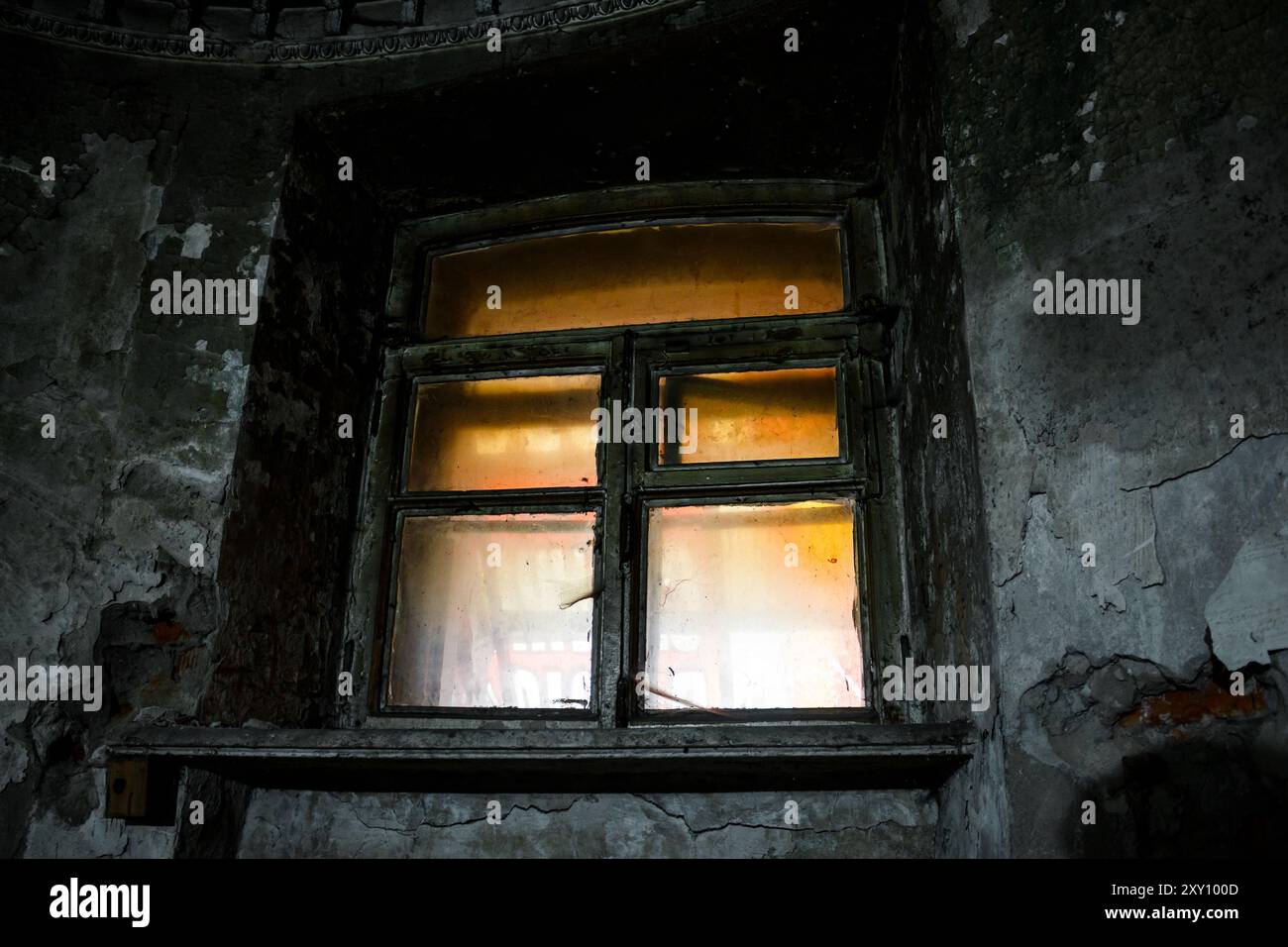 Dirty window in the basement barely letting in sunlight, abandoned ...