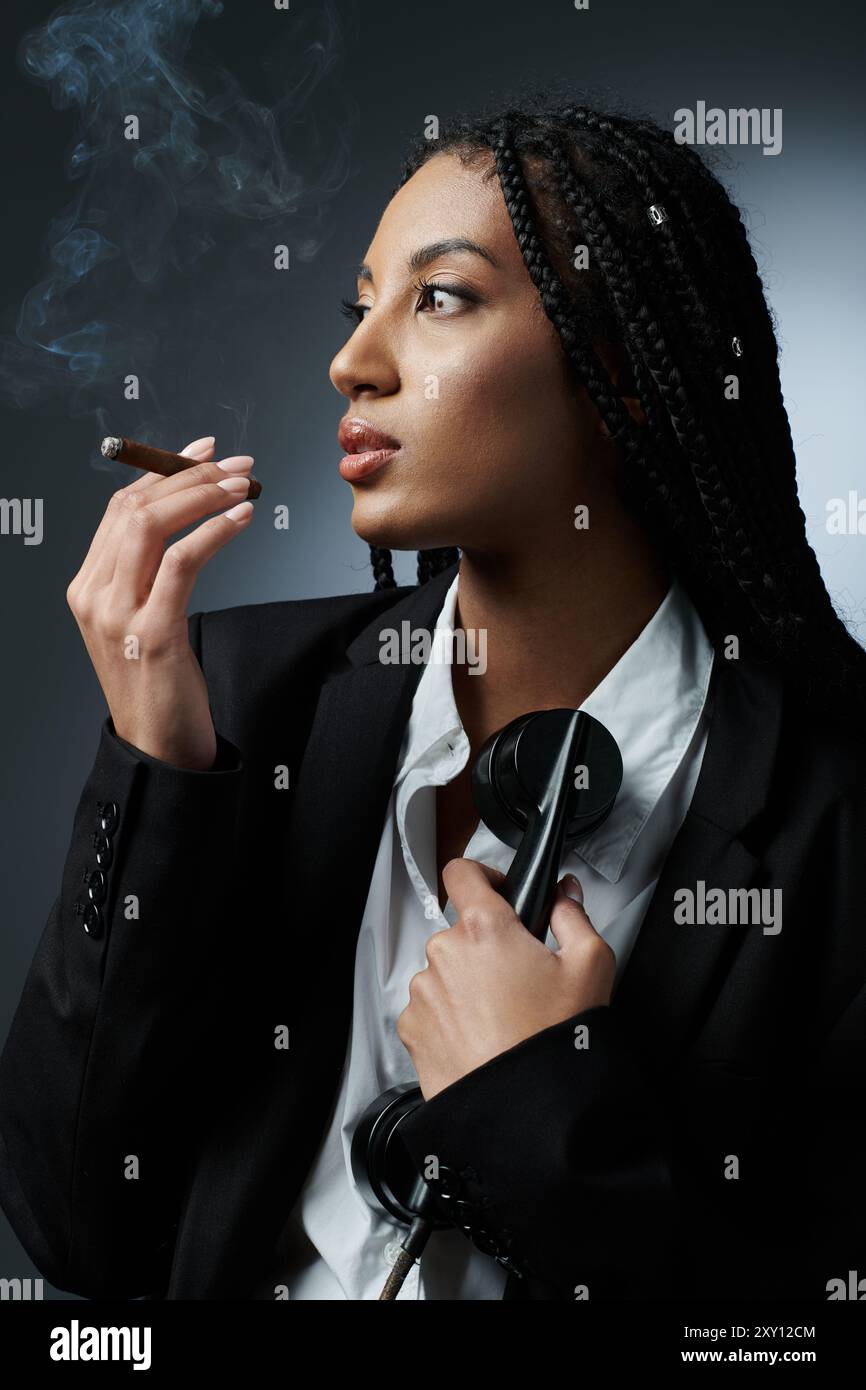 A chic African-American woman in her 20s with braids, white shirt, and ...