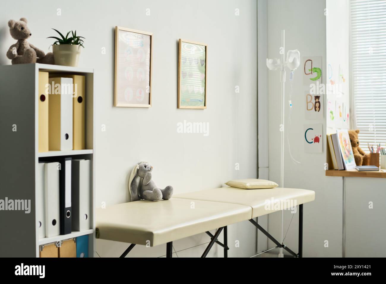 Pediatric examination room with minimalist decor, featuring soft toys ...