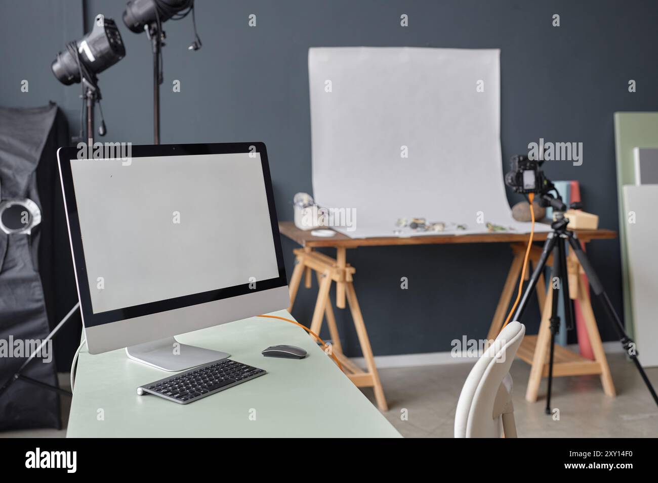 Background image of photographers studio with white screen computer on ...