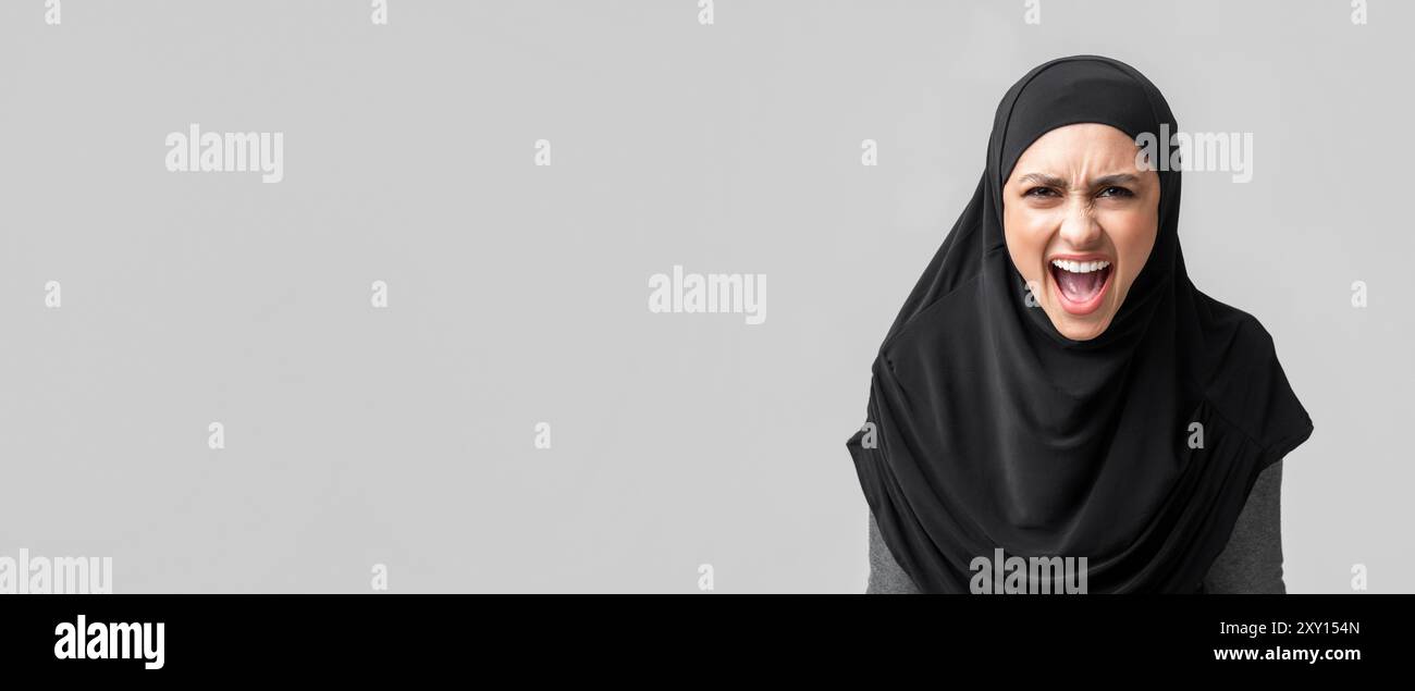 Angry muslim girl in hijab screaming loud, emotionally protesting about ...