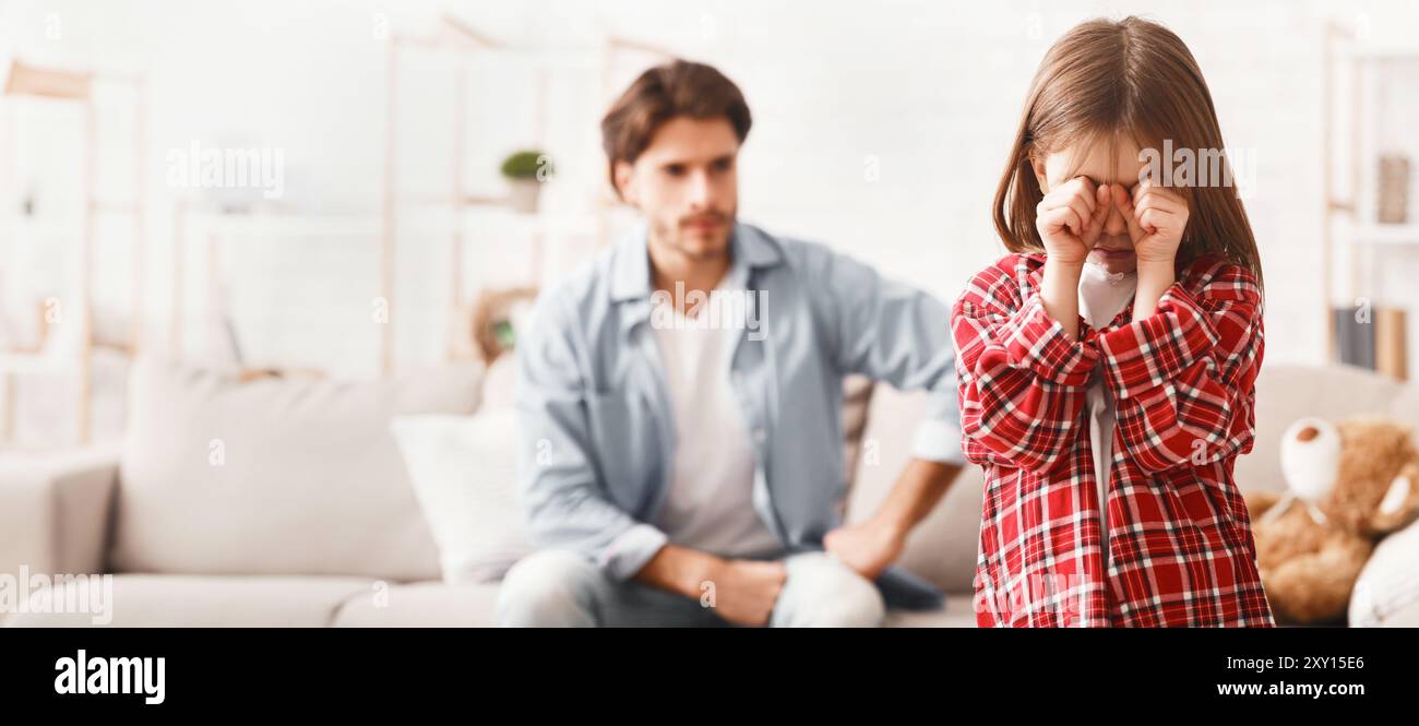 Little girl crying after arguing wIth dad, angry father behind Stock ...