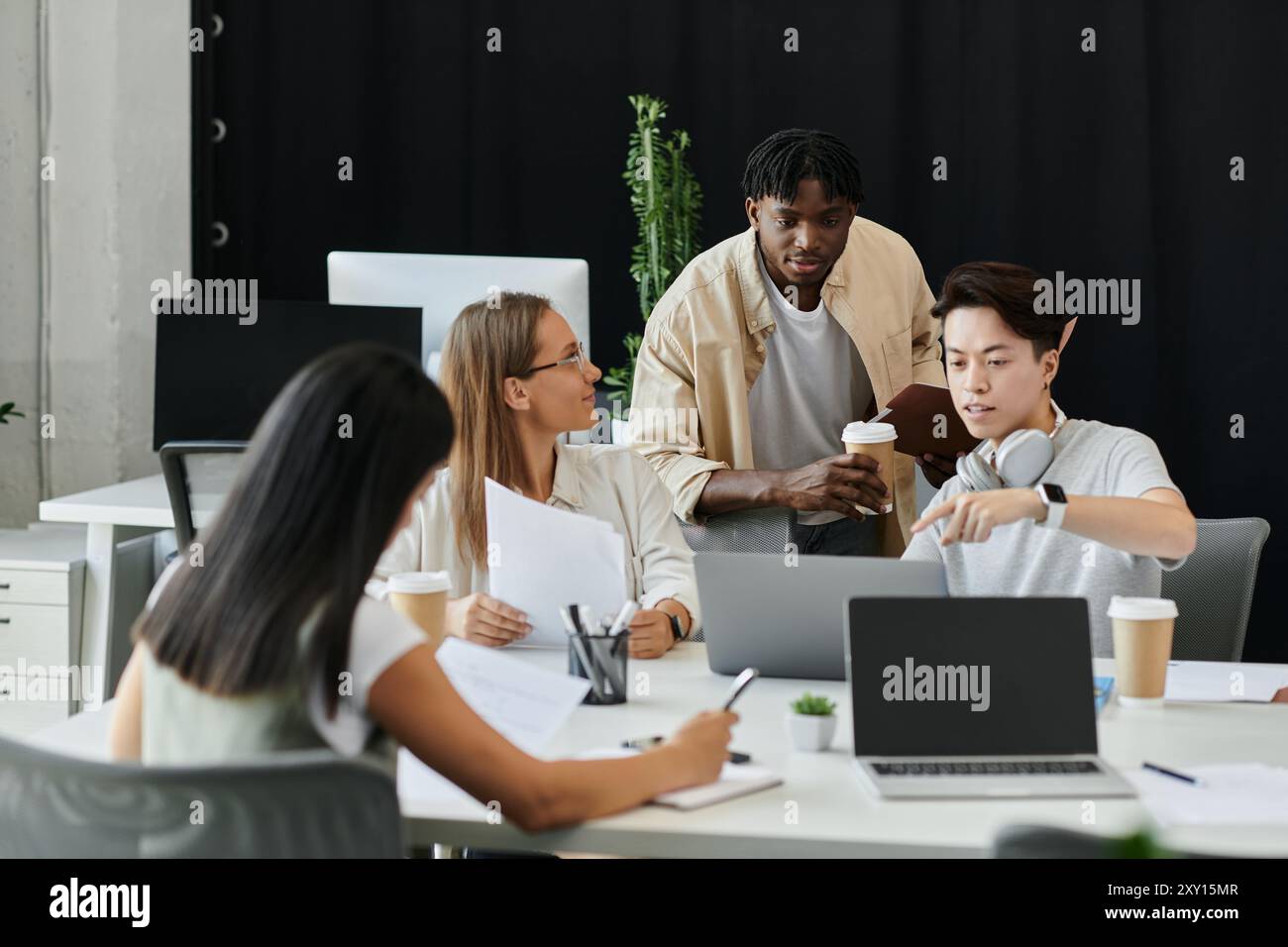 Team four business people working hi-res stock photography and images ...