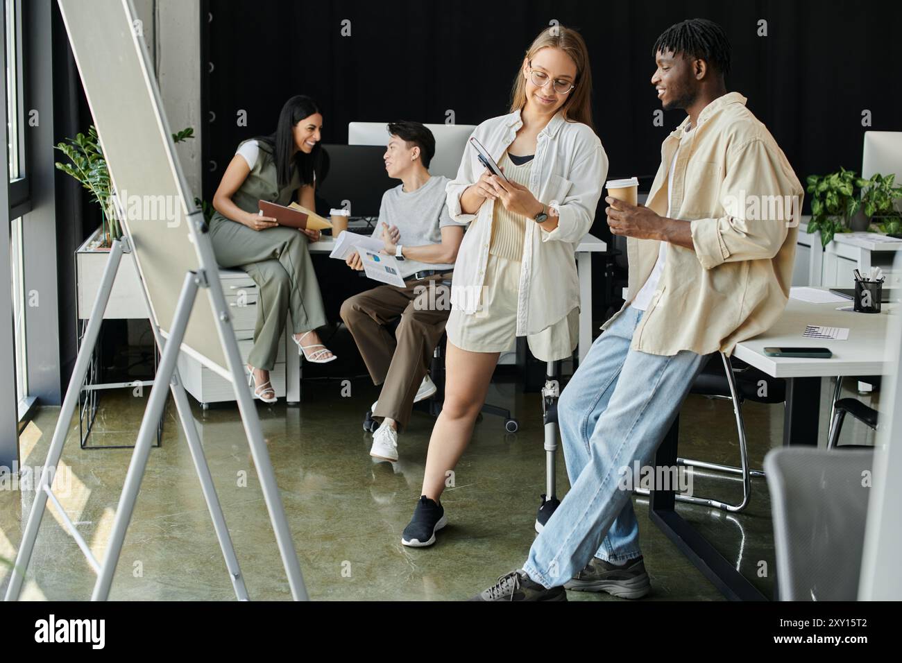 A diverse team of professionals work together in a modern office ...