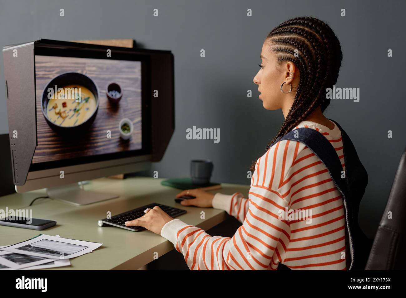 Side view portrait of young Black woman with cornrows hairstyle as ...
