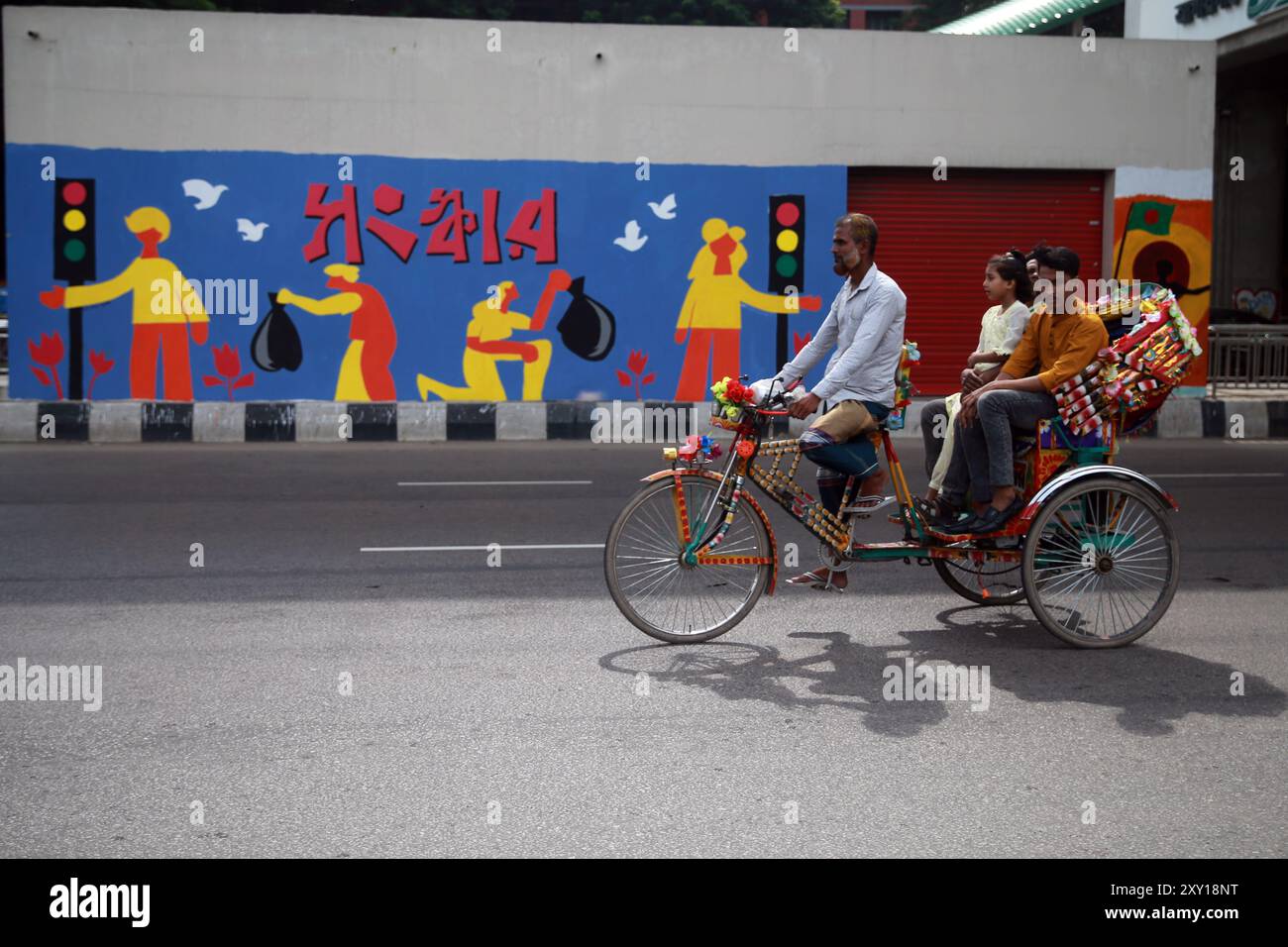 The graffitied walls at Agargaon Area are decorated with various ...