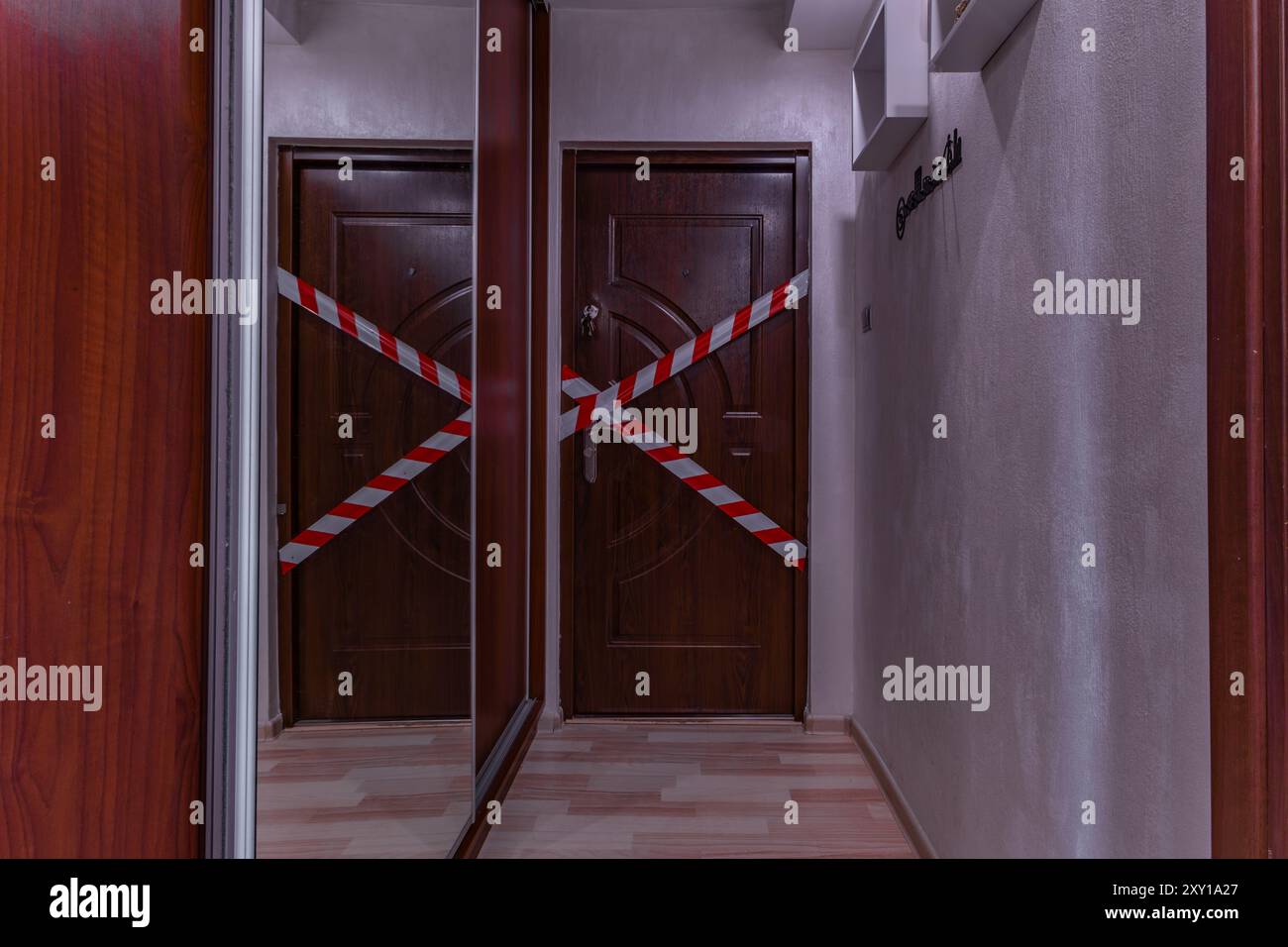 The entrance door to the apartment, police tape, secured the crime ...