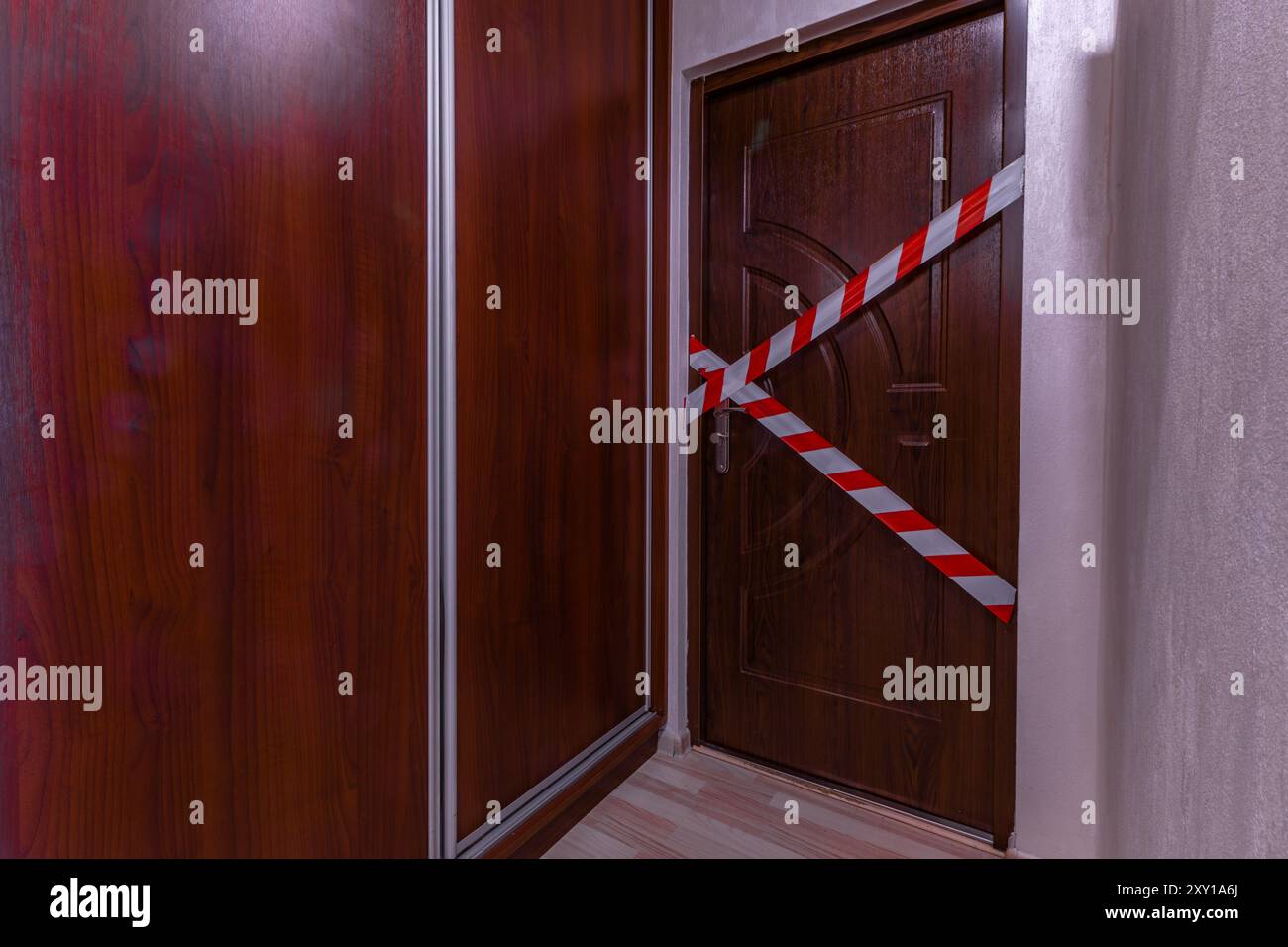 The entrance door to the apartment, police tape, secured the crime ...