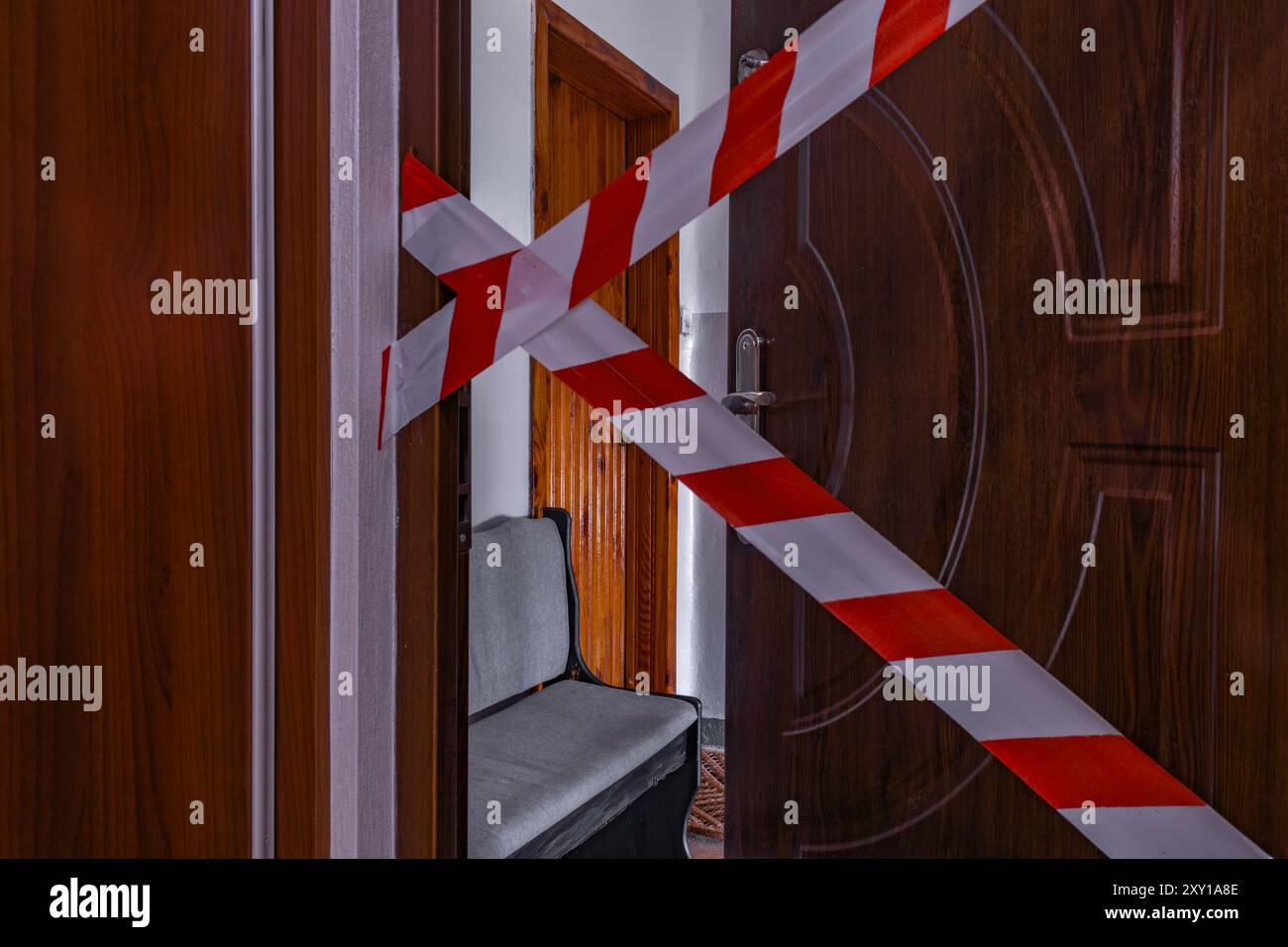 The entrance door to the apartment, police tape, secured the crime ...