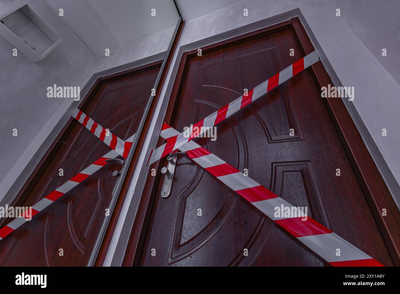 The entrance door to the apartment, police tape, secured the crime ...