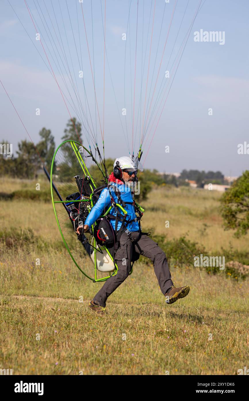 Pilot of powered paragliding landing Stock Photo - Alamy
