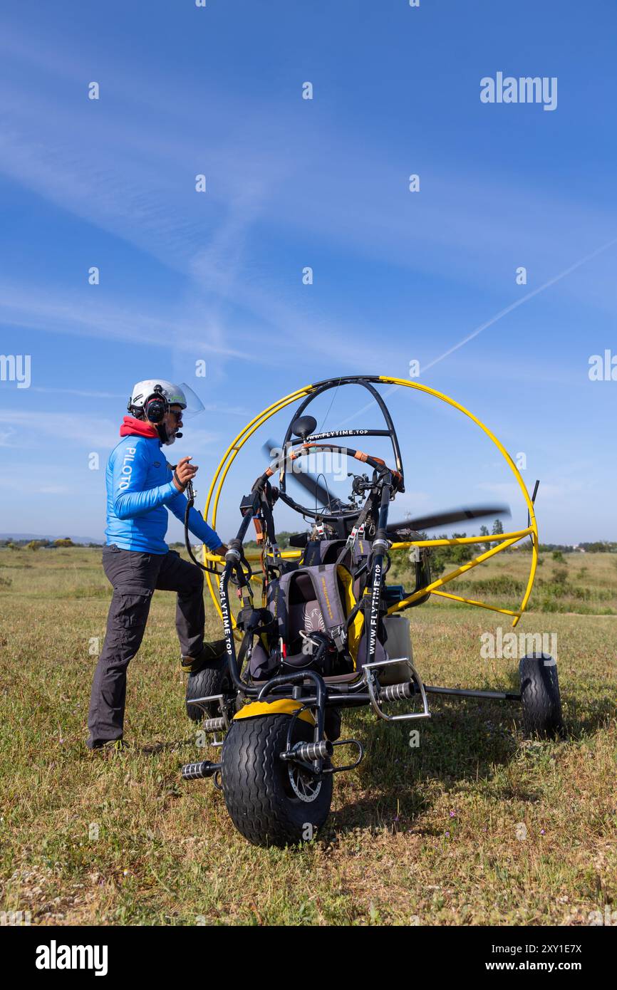 Paragliding pilot checking the paramotor Stock Photo - Alamy