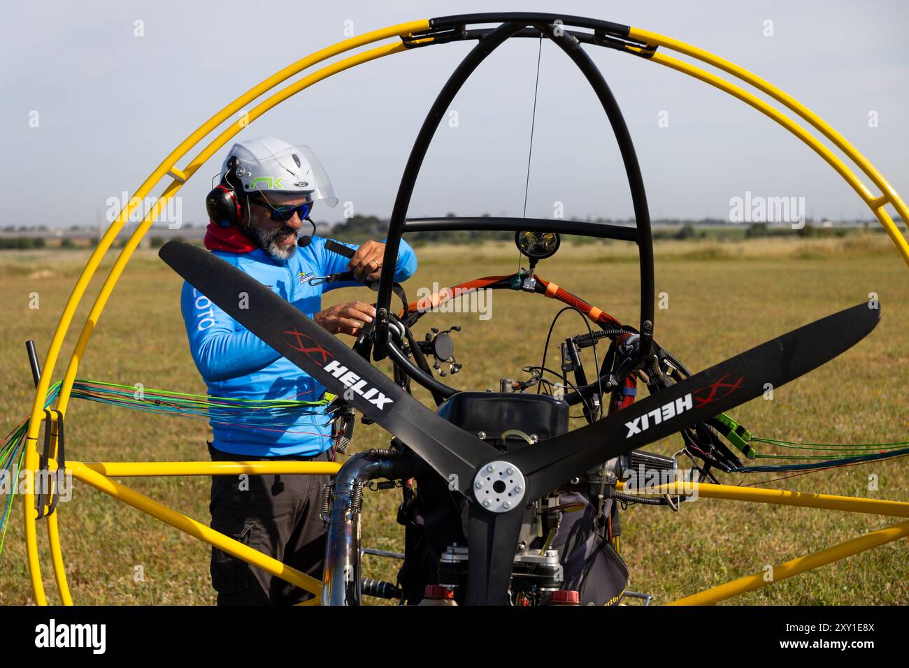 Paragliding pilot checking the paramotor Stock Photo - Alamy