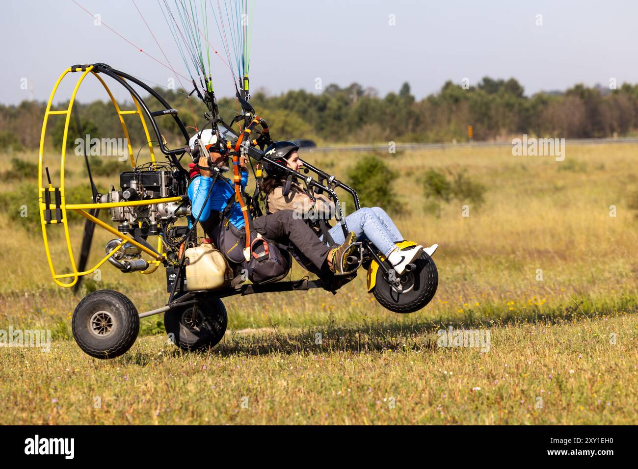 Powered paragliding landing Stock Photo - Alamy