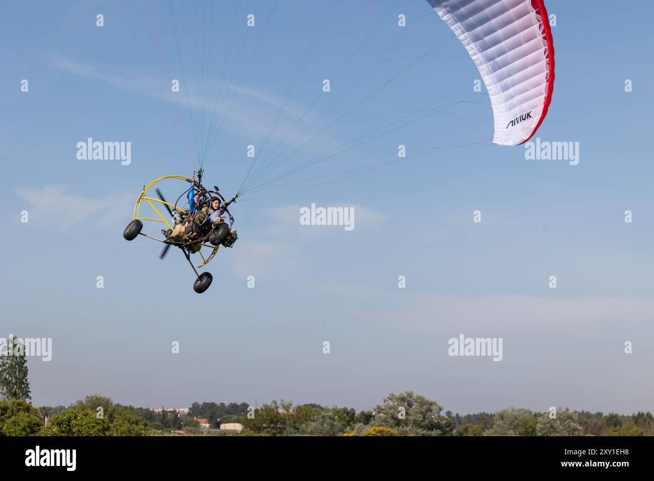 Powered paragliding flying Stock Photo - Alamy