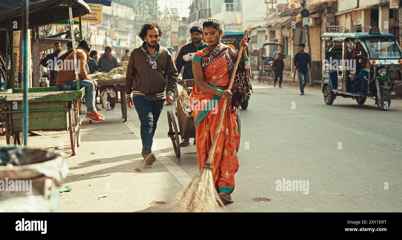 Varanasi, India. Indian Untouchable Caste Woman Sweeping The Street ...