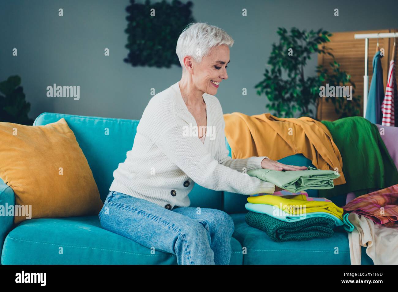 Fashion model organizing wardrobe hi-res stock photography and images ...