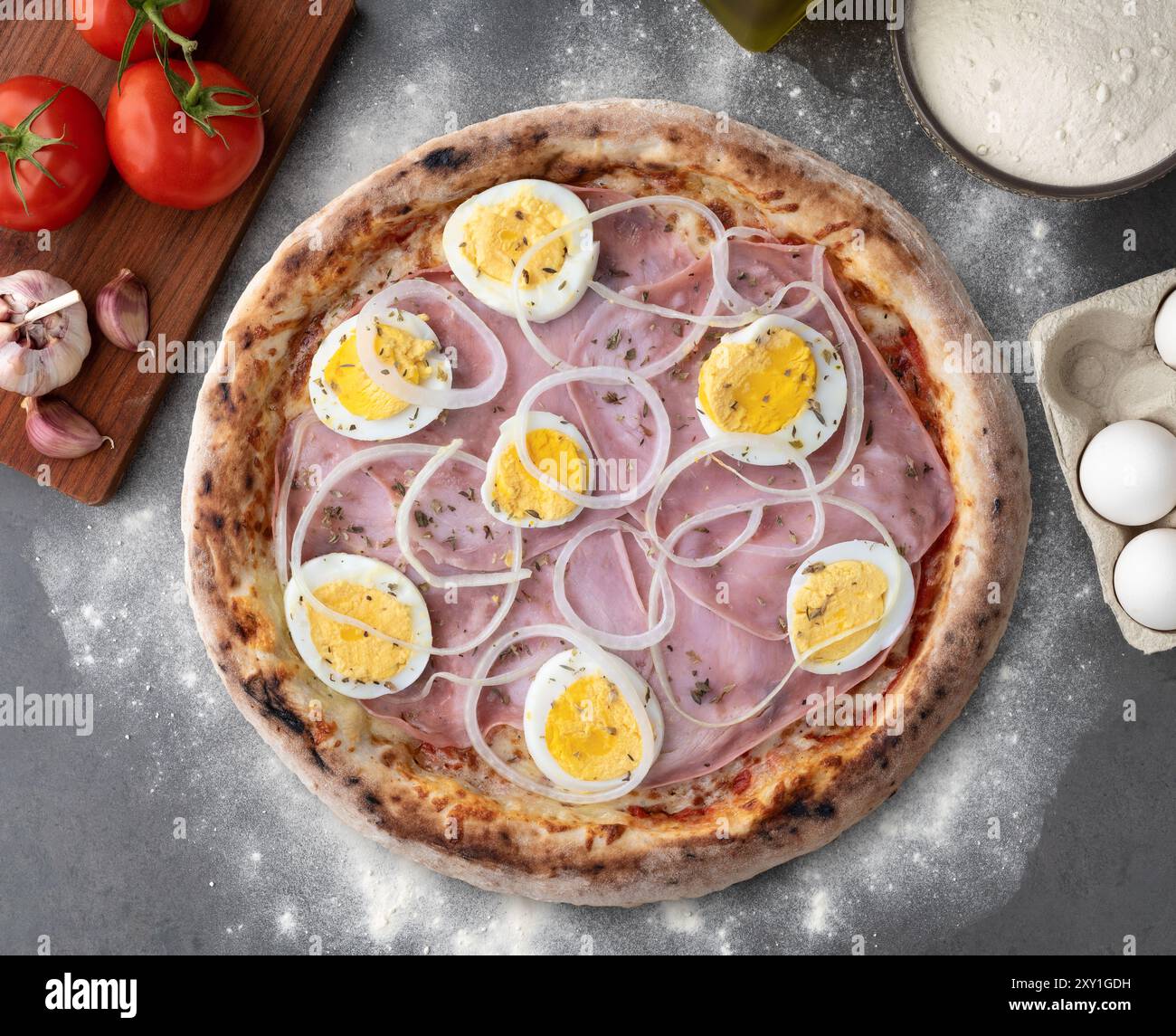 Portuguese pizza over stone background with ingredients Stock Photo - Alamy