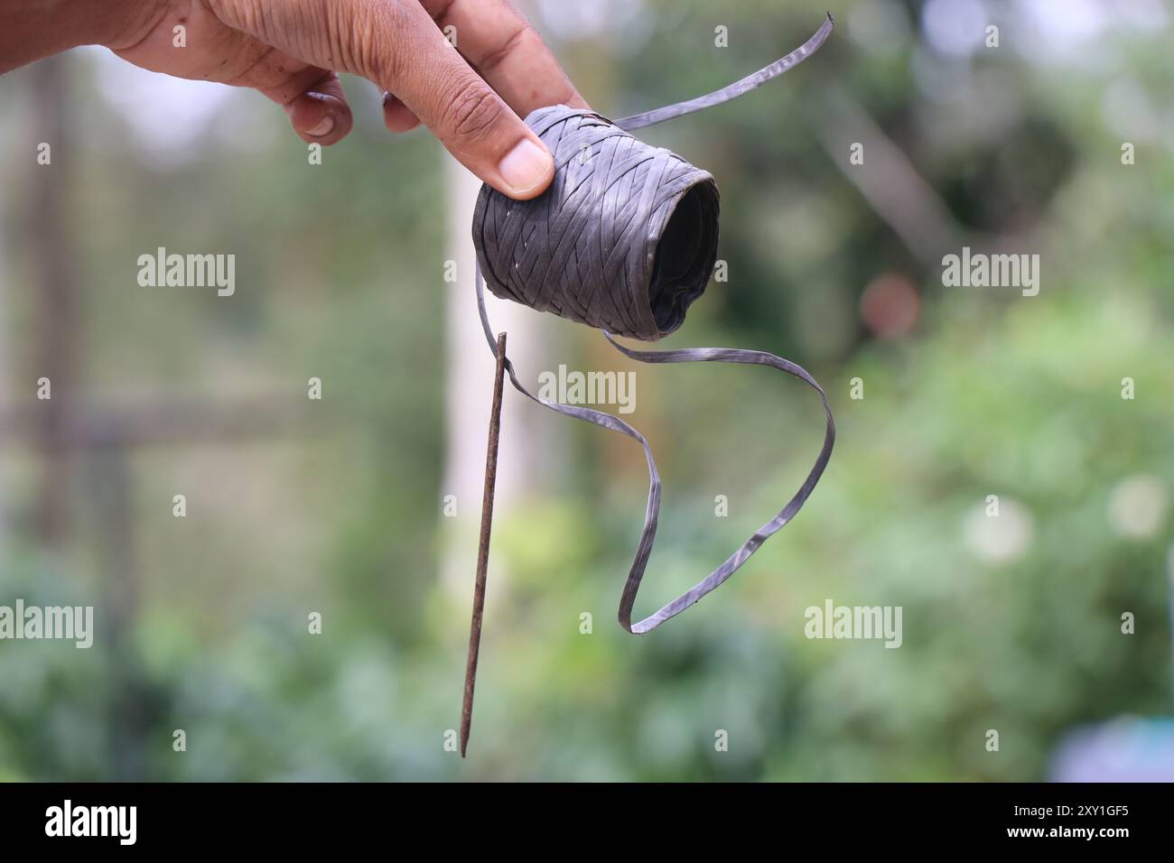 Plastic wire and long sewing needle. Traditional equipment for patching ...