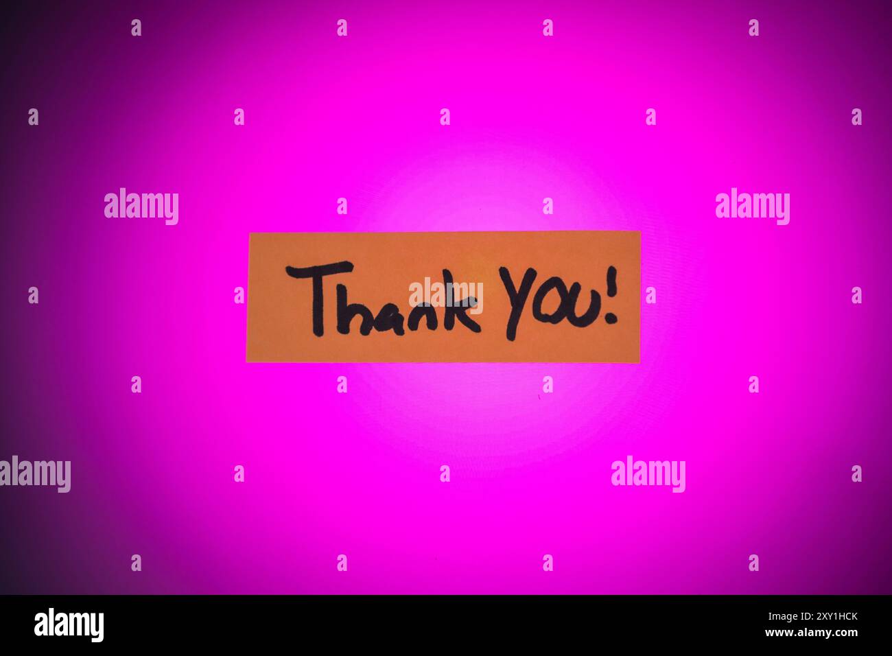 A thank you note on a computer screen. The note is on a pink screen ...