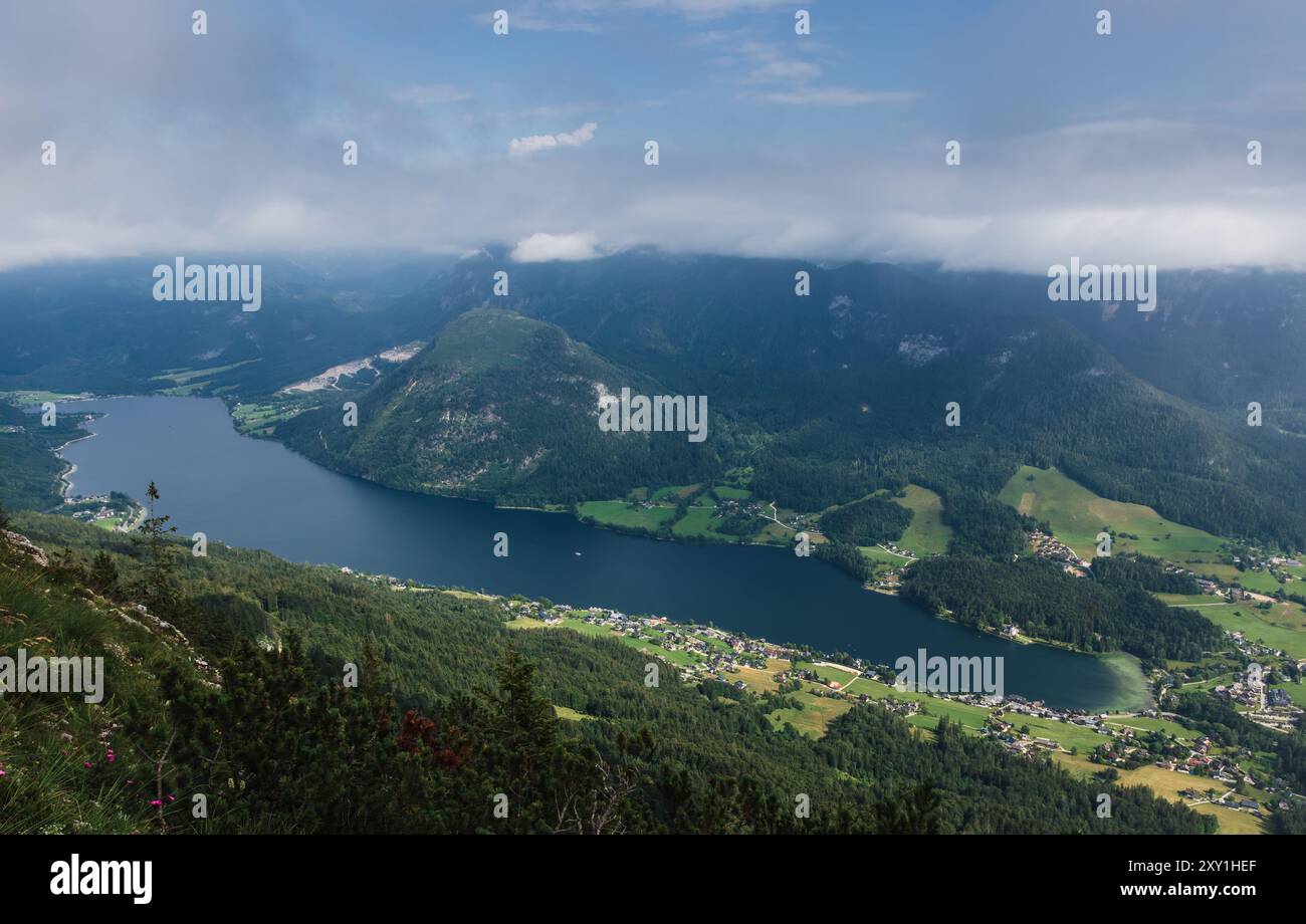 Alps mountain lake Grundlsee with village in valley at overcast weather ...