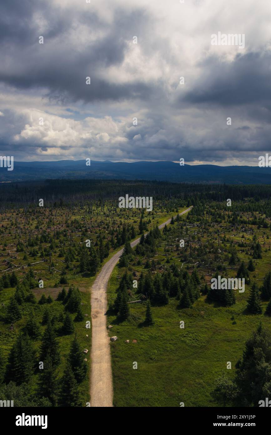 Tourist path with dramatic sky and hill. View from lookout tower ...