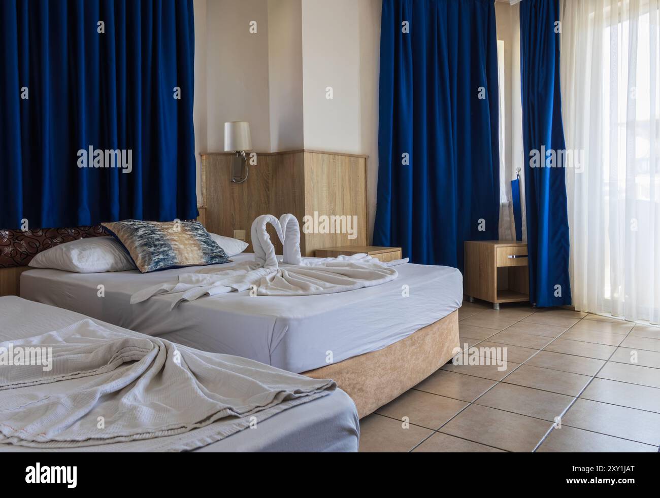 Hotel room with swan towels on bed in turkey. Accommodation concept ...