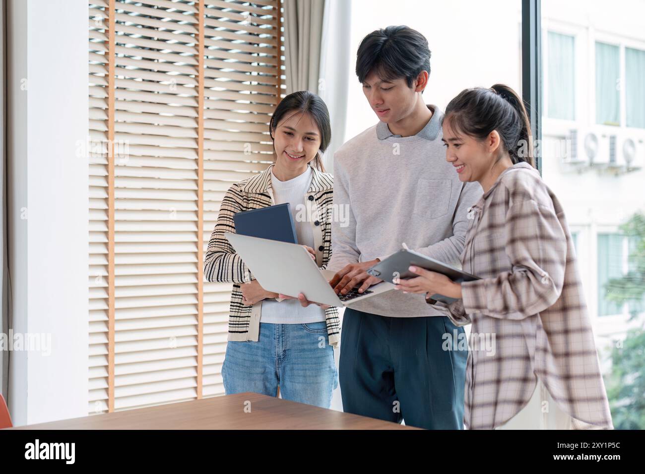 Diverse Students Discussing Academic Project with Technology Stock ...