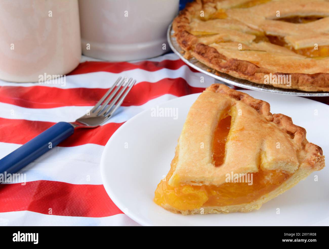 A slice of fruit pie on an American Flag table cloth Stock Photo - Alamy