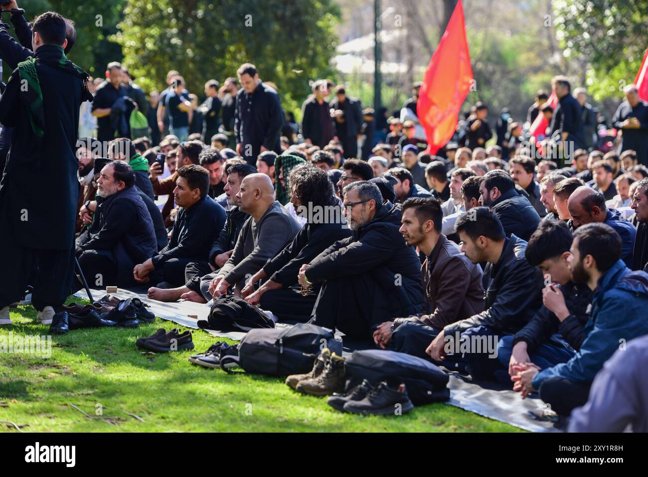 Melbourne, Australia. 25th Aug, 2024. Shia men are sitting down for a ...