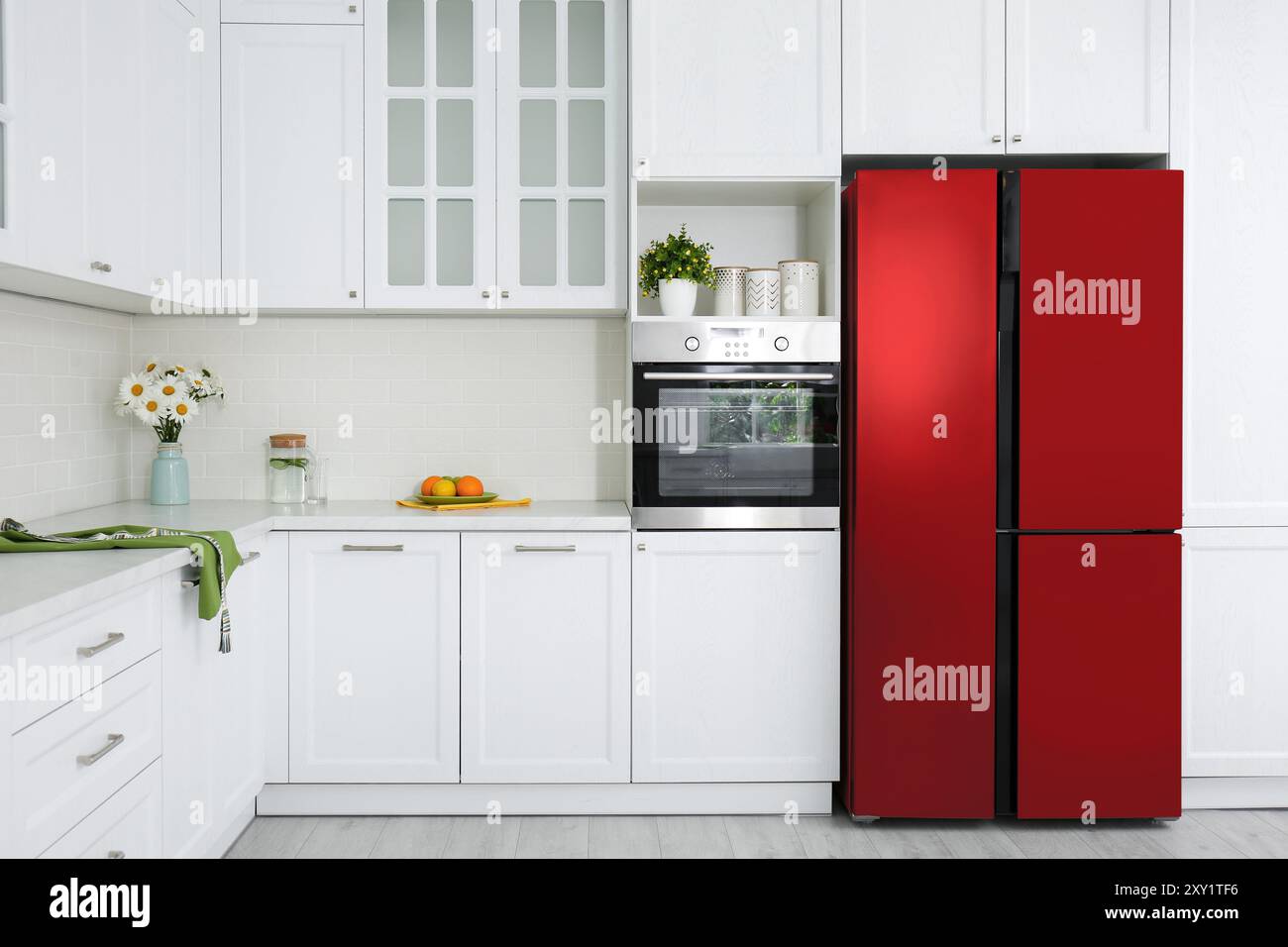 Red refrigerator in kitchen. Bright color accent in interior Stock ...