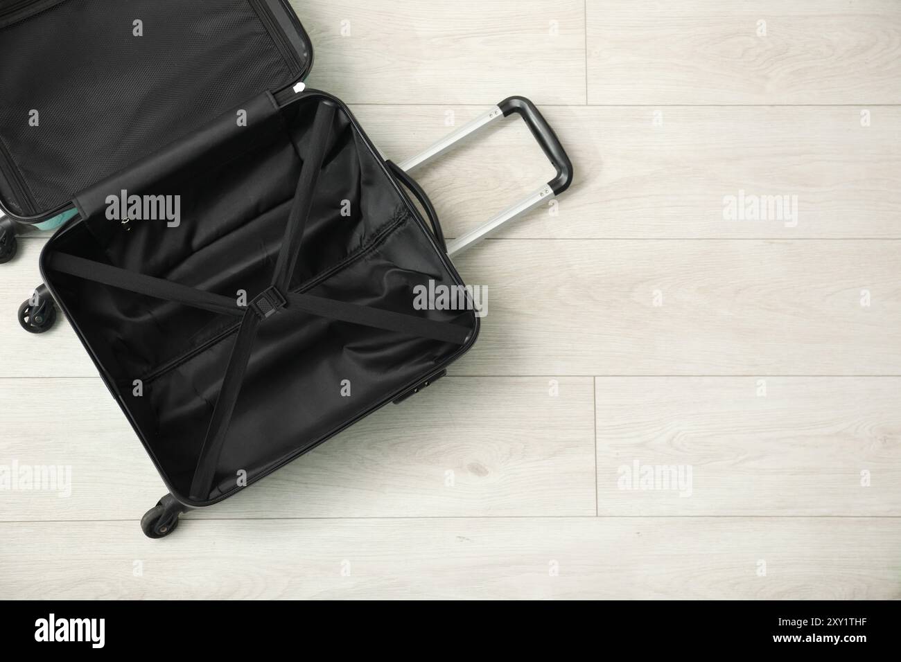 Open empty suitcase on floor indoors, top view. Space for text Stock ...