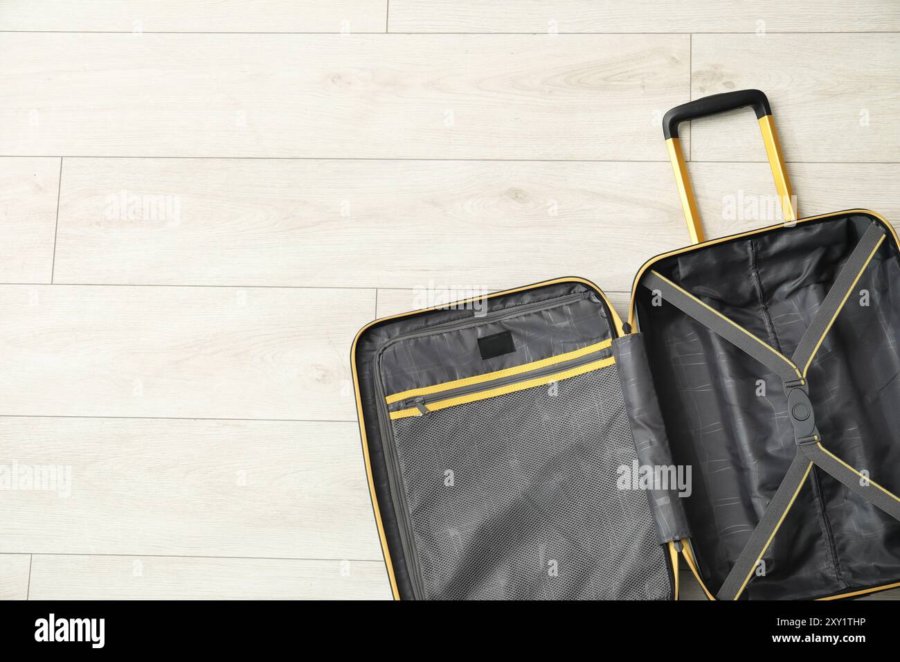 Open empty suitcase on floor indoors, top view. Space for text Stock ...