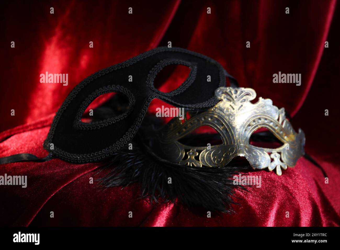 Beautiful carnival masks on red silk fabric Stock Photo - Alamy