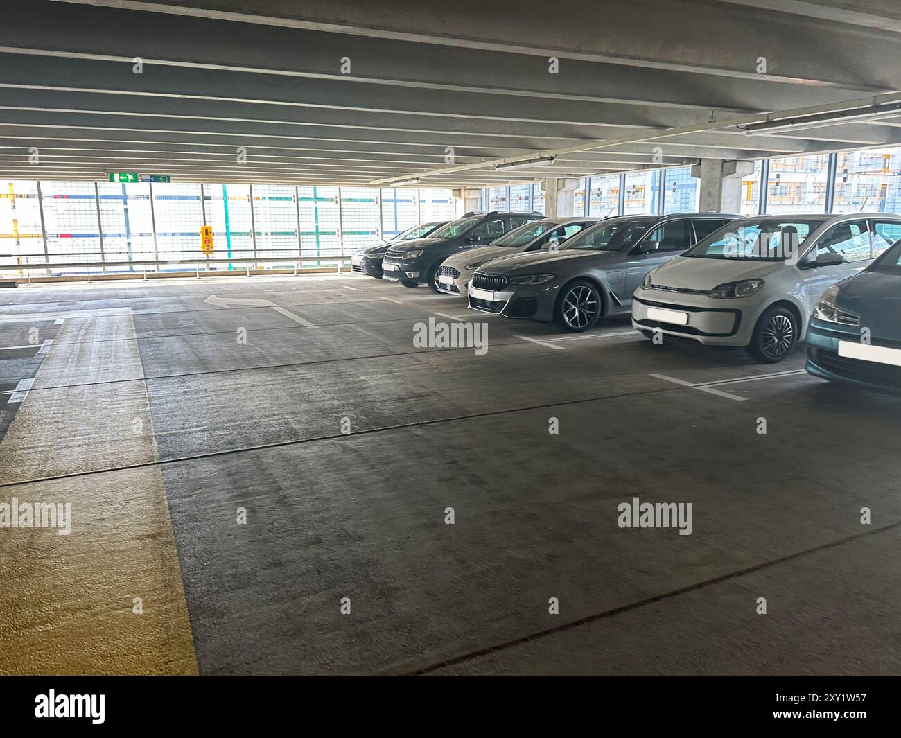 Parked cars in underground garage of apartment complex Stock Photo - Alamy