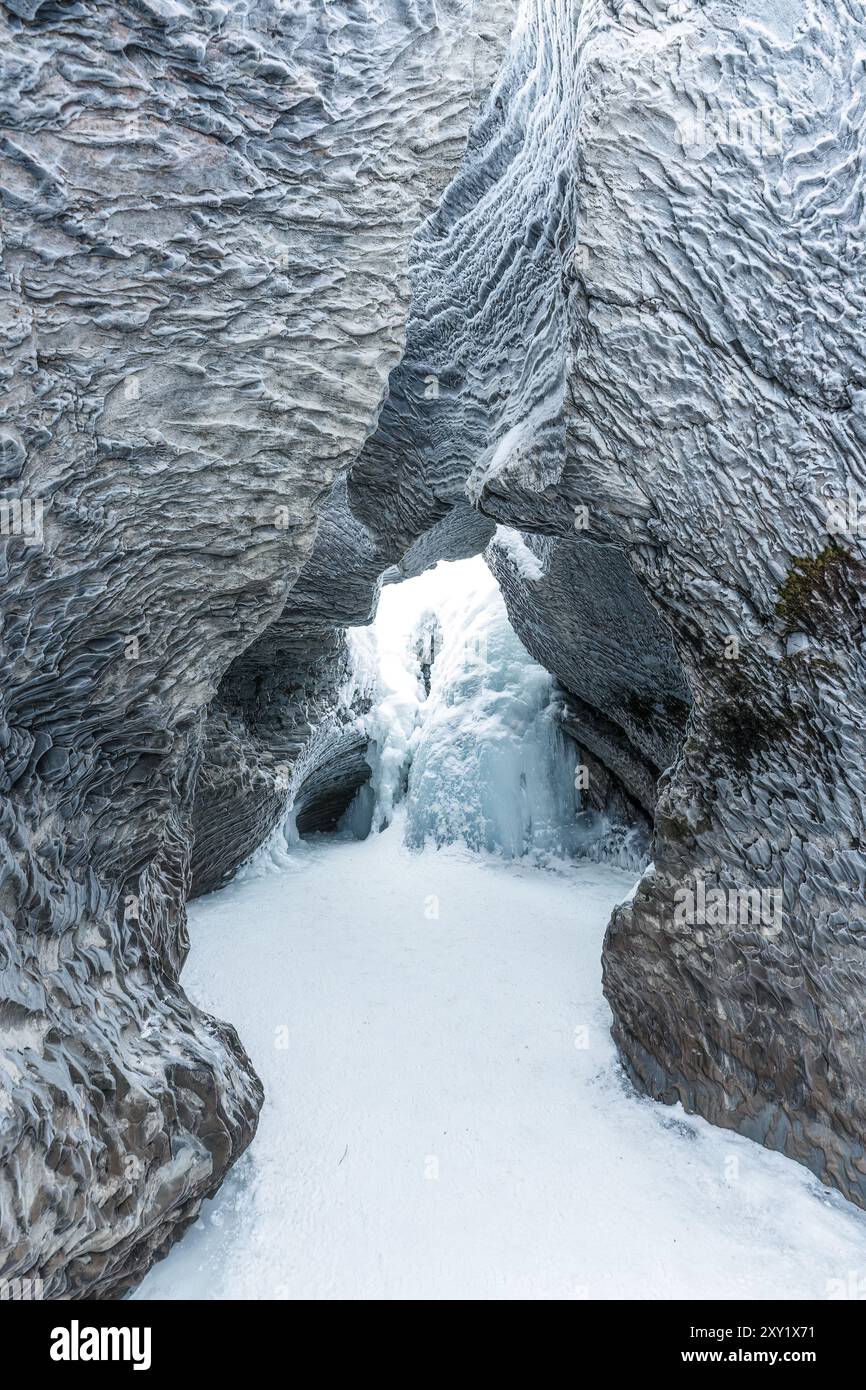 Beautiful Ice cave with rock formation of water eroded on winter at ...