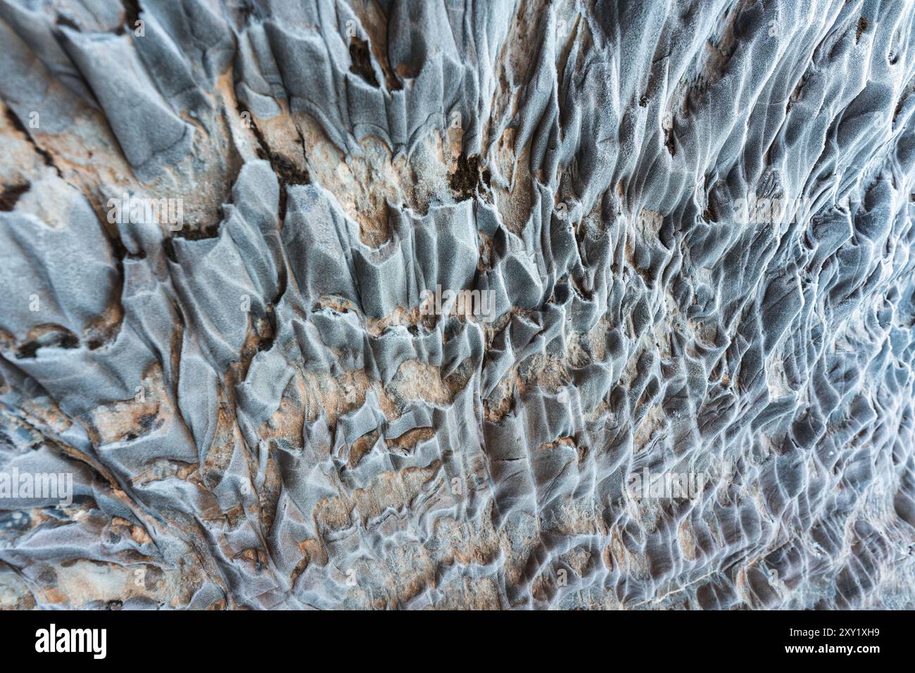 Abstract weathered rocky limestone mountain cave with lichen surface ...