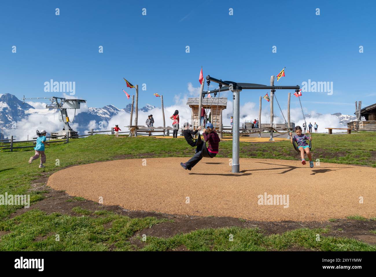 Mannlichen, Switzerland - July 23, 2024: Children play on various ...
