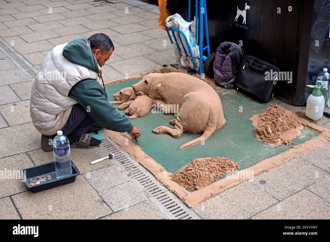 Sand dog sculpture busker on Princes Street, Edinburgh, Scotland, UK ...