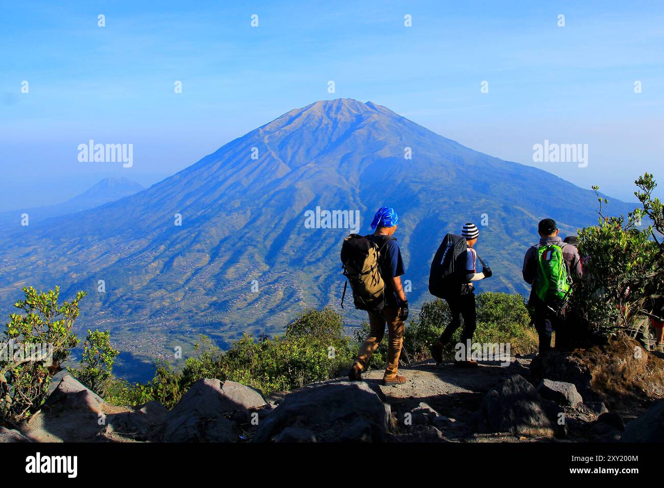 Climbers cross the Mount Merapi climbing route via Selo Boyolali with a ...