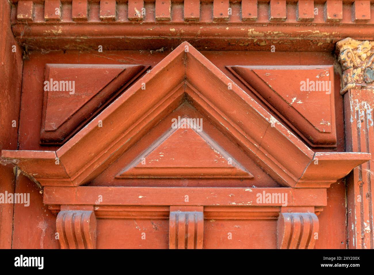 The elaborate design features geometric shapes and textures in rich red ...