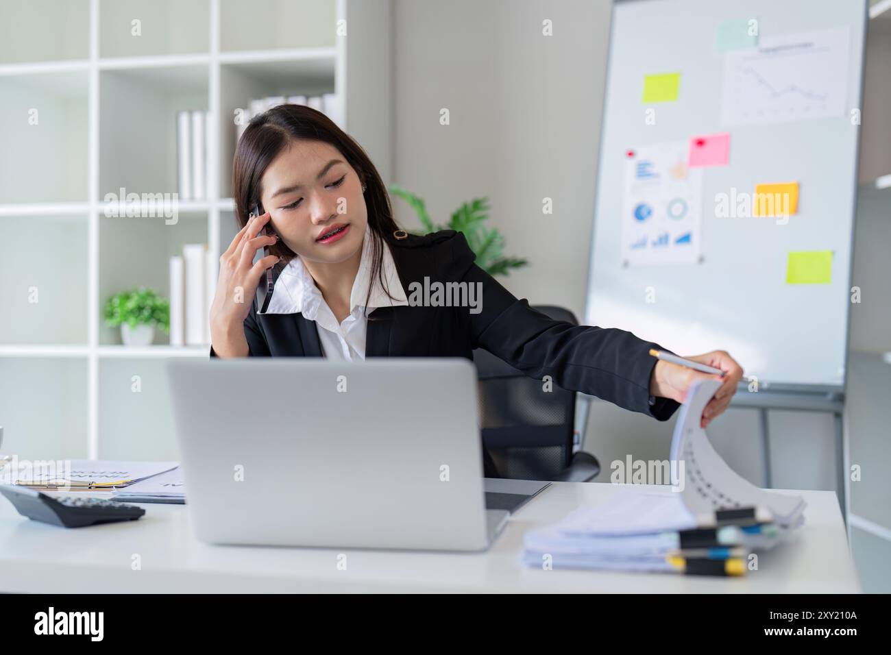 Professional Woman Multitasking in Modern Office Environment Stock ...