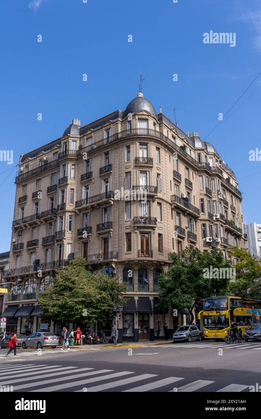 A vintage apartment building with shops on the ground floor on Avenida Belgrano & Ave. Balcarce ...